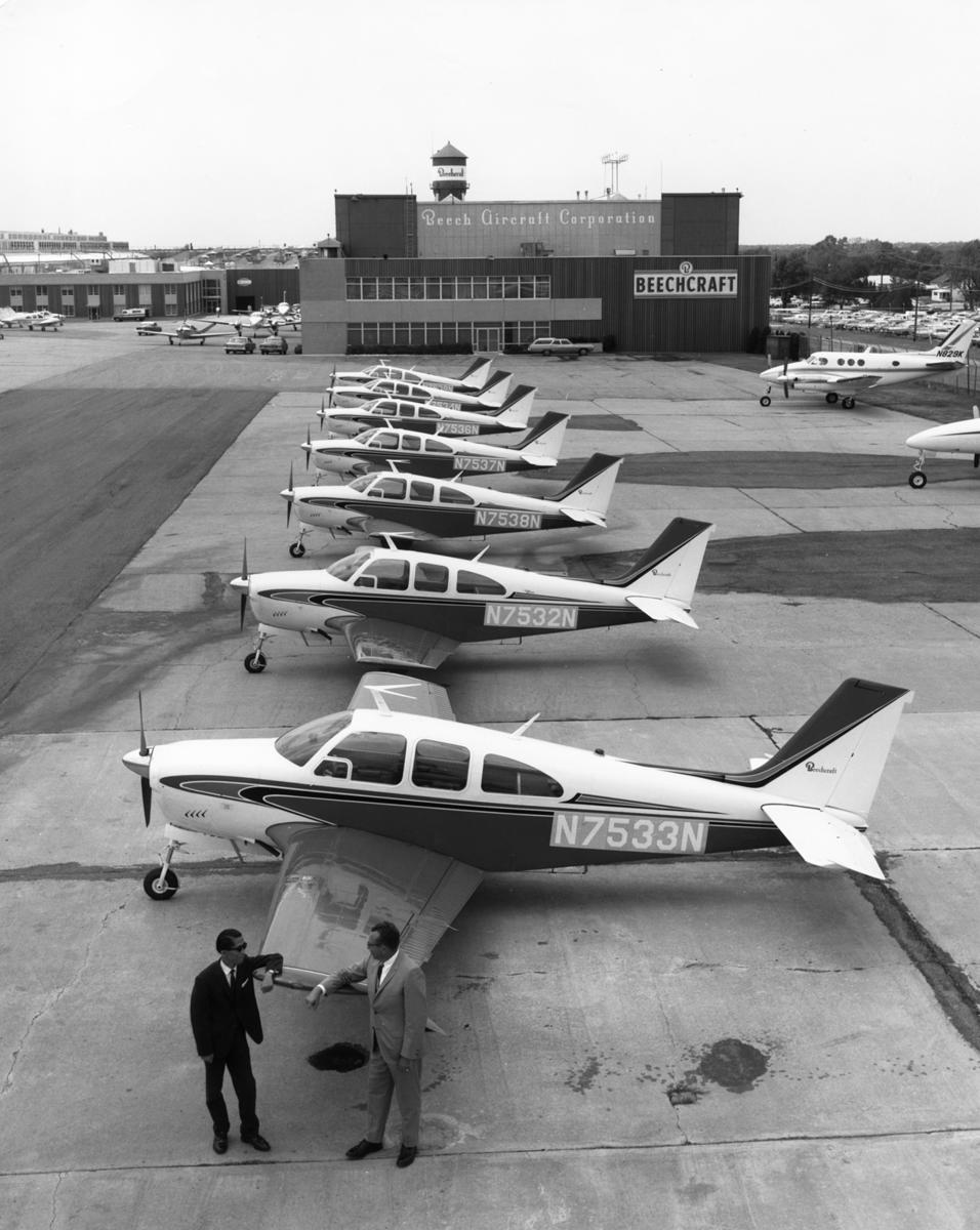 Seven Beechcraft E33 Bonanza aircraft are lined up at Beech Aircraft at Wichita - Museum of ...