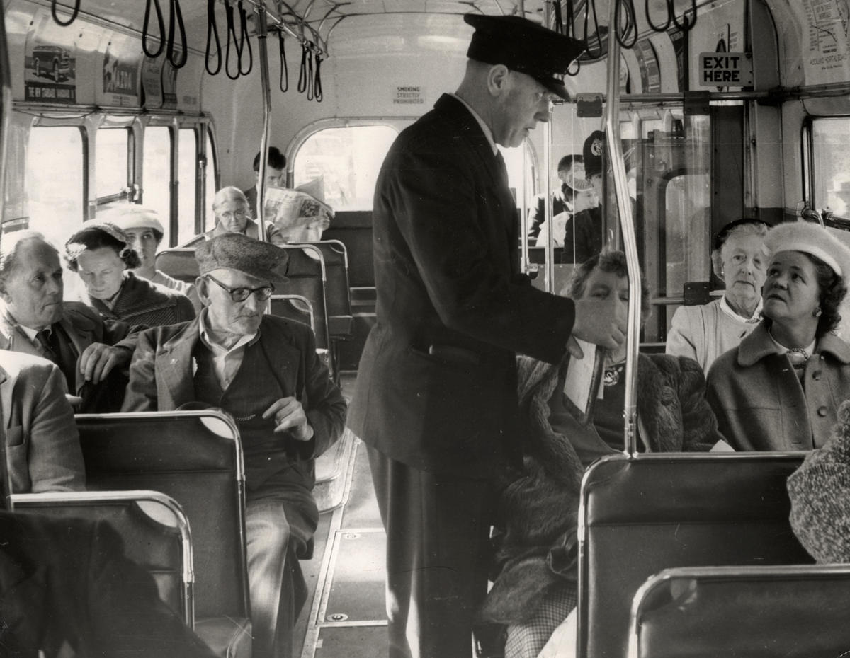 [Inspector clipping tickets on trolley bus] - Museum of Transport and ...
