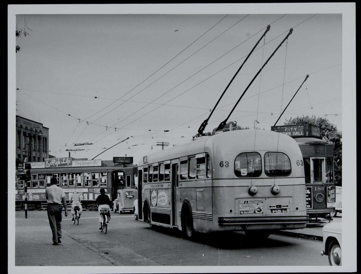 [Trolley bus 63 and trams including number 180 at Symonds Street ...