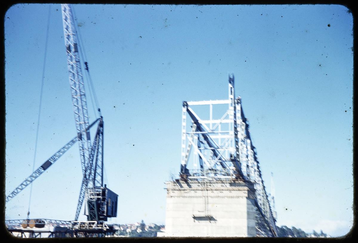 Floating crane alongside bridge superstructure and pier under ...